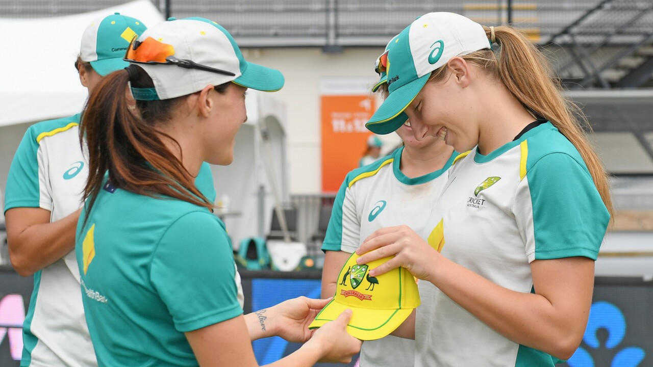 Darcie Brown receives her cap from hilarious Megan Schutt